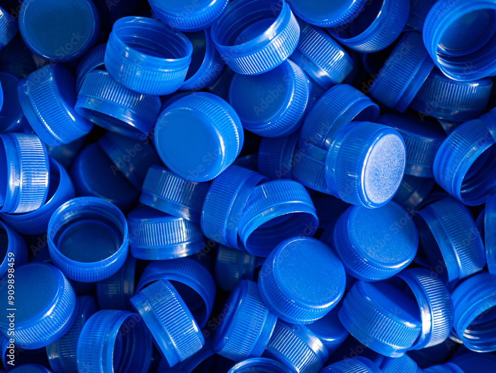 Top view blue plastic bottle caps.Recycling collection and production ...