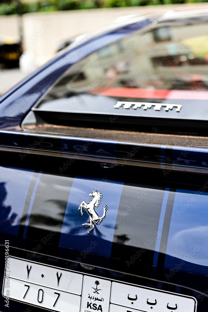 Modena, Italy - July 30 2024:A close-up of the Ferrari logo on a red ...