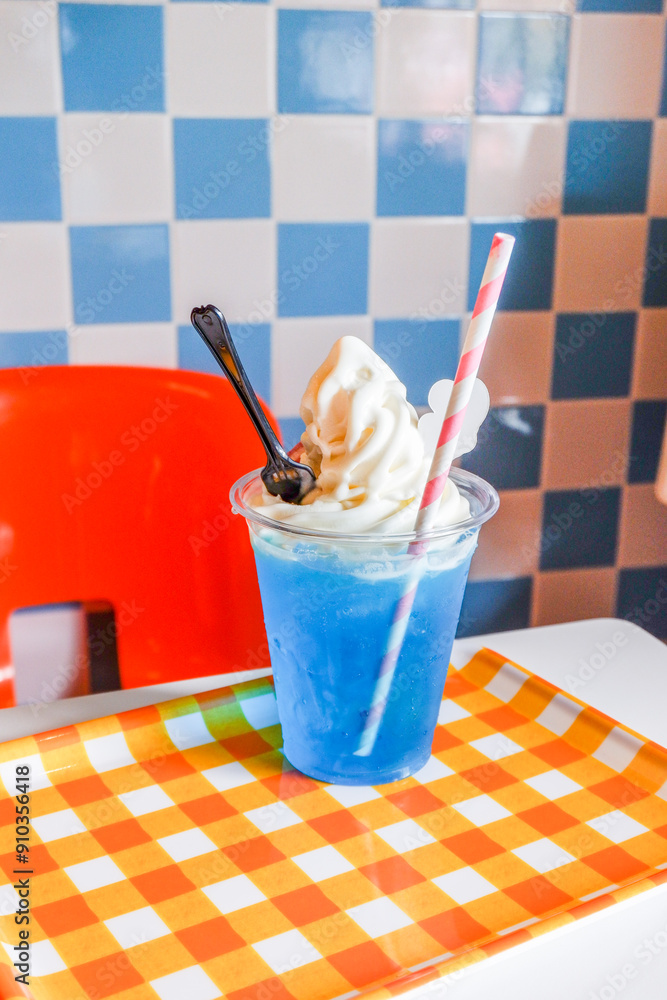 Blue Hawaii Soda float with vanilla ice cream on table in cafe,one of ...