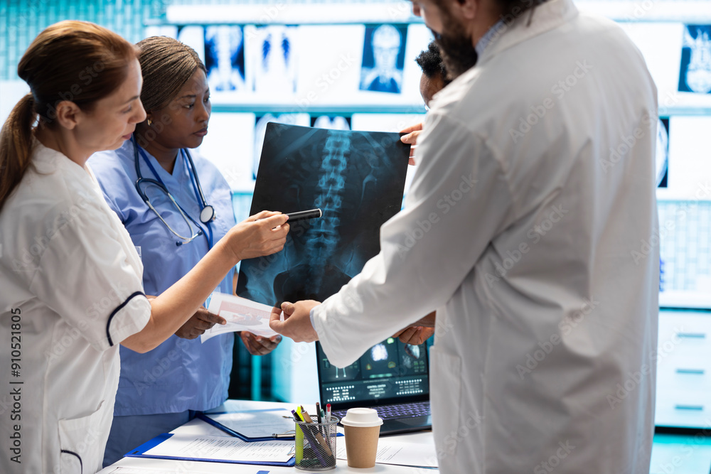 Doctors analyze human anatomy scans in a treatment center, teamwork and ...