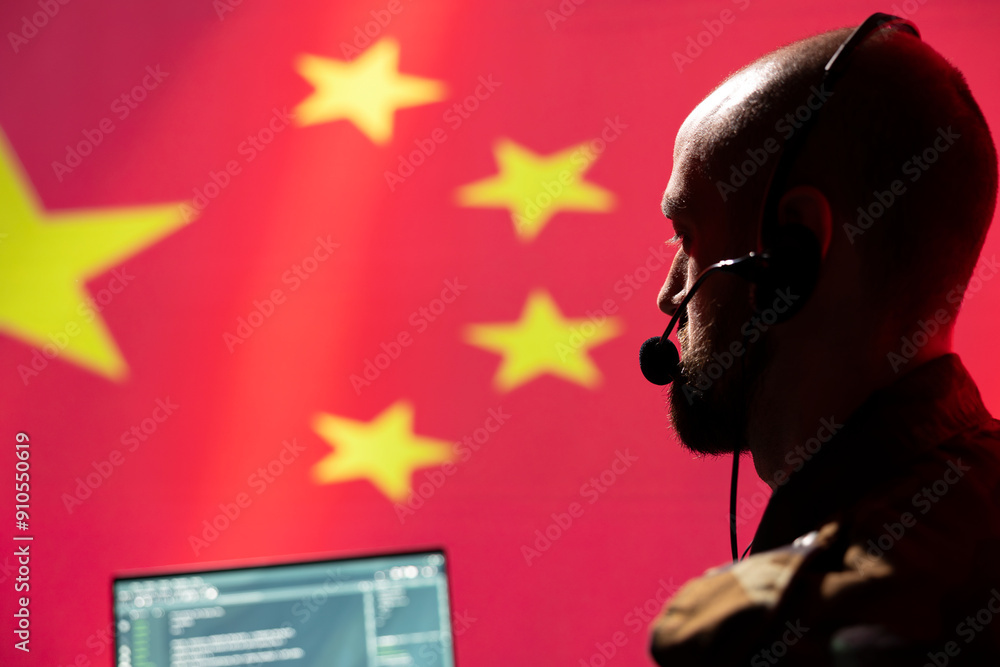 Chinese army communication systems operator using radio and satellite equipment, providing ...