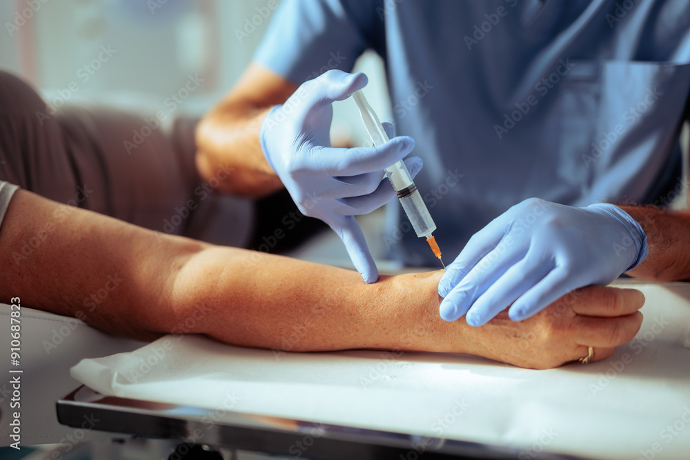 Anesthesiologist Injecting the Arm of a Patient for Surgery. Doctor ...
