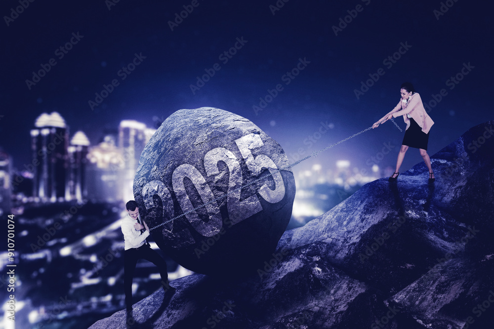 Business people collaborate to move a boulder as an obstacle in 2025 ...