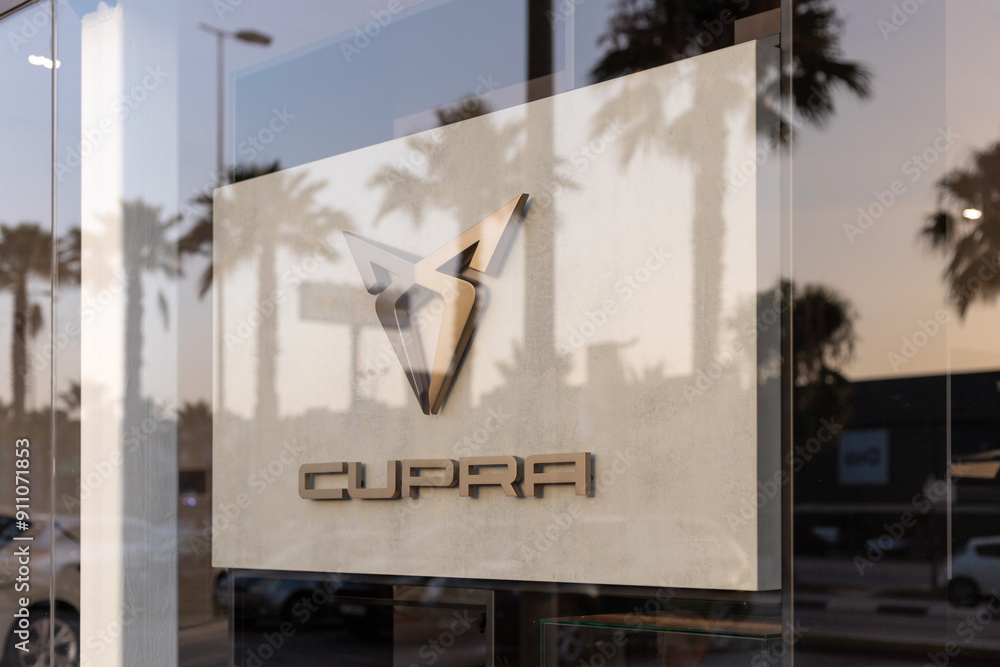 Cupra logo, highlighted by golden hues of a setting sun. Ideal for ...