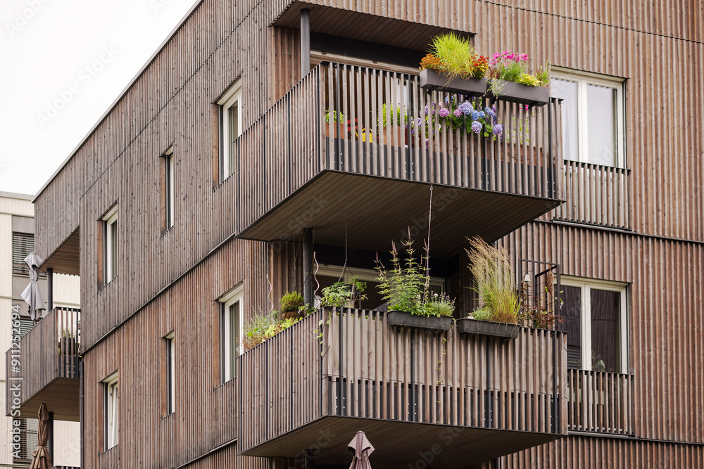 Wooden Facade of Modern High rise Apartment Building with Wood Balcony ...
