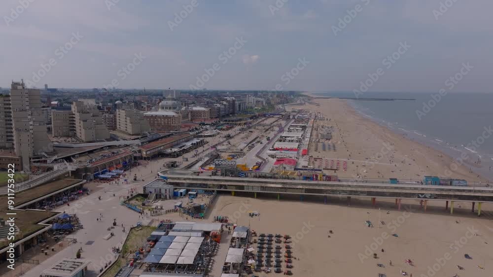 Vibrant beachfront of The Hague with its iconic skyline, bustling pier ...