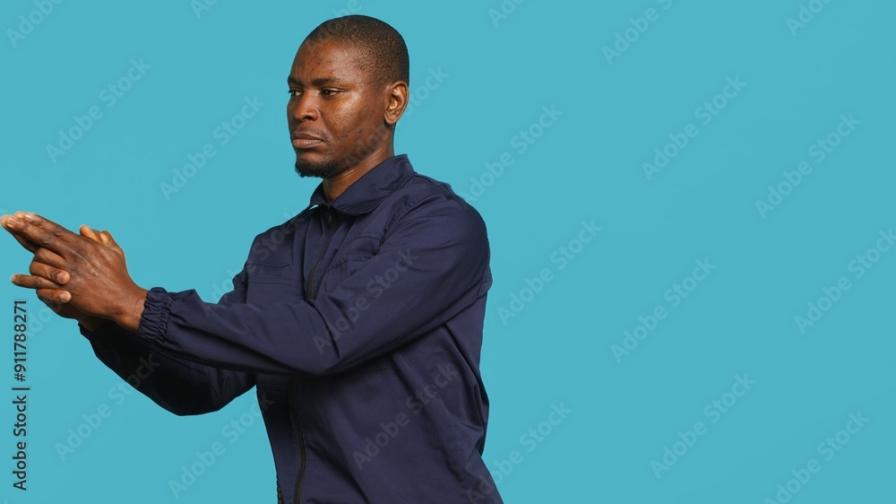 Portrait of security job employee shooting gun, detaining perpetrators ...