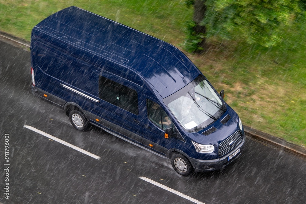 Ford Transit Mk4 panel van driving on wet road, heavy rain with motion ...