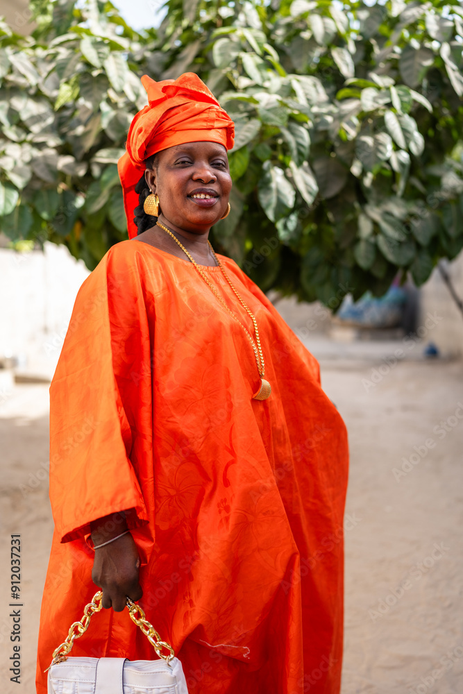 Senegalese woman wearing traditional clothes posing in street Stock ...