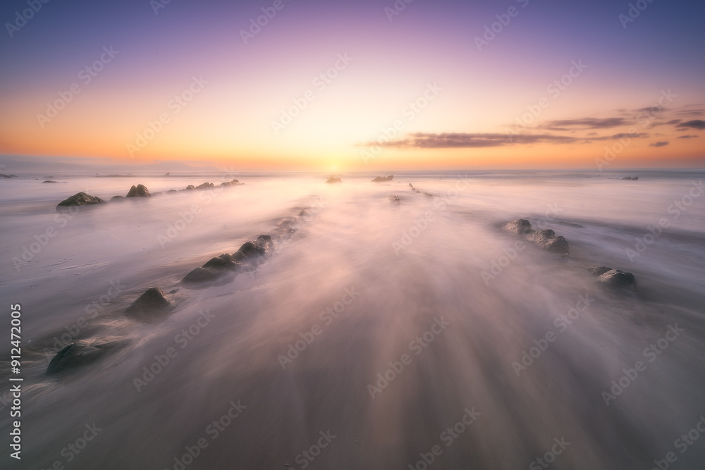 Sunset on Barrika beach, Bizkaia with the waves of the Cantabrian Sea ...