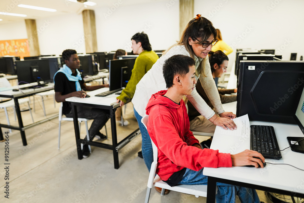 Students using computers softwares at college IT class - Woman teacher ...