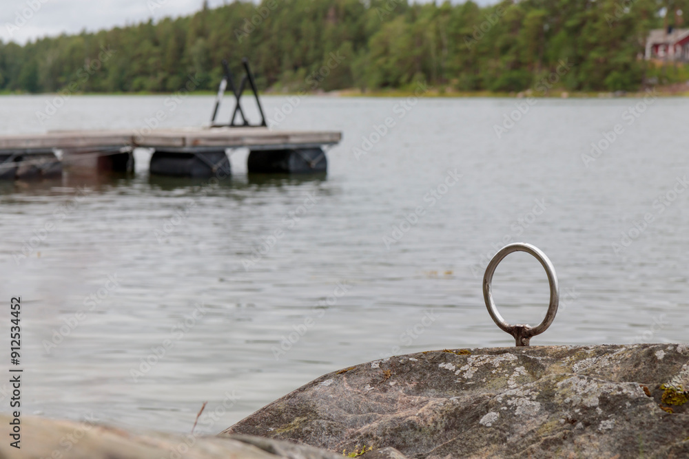 Mooring ring for boats in the stone, old gray wooden pier, pontoon on ...