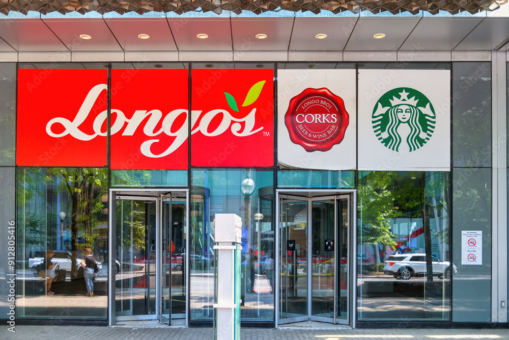 Commercial building entrance with logos of Longos, Starbucks, and Corks ...