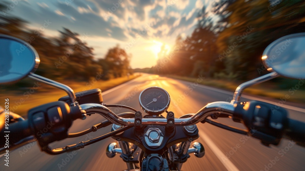 Driving a motorcycle on a scenic highway at sunrise or sunset ...