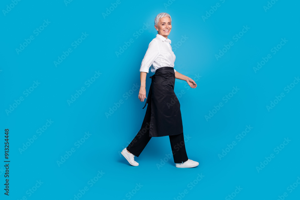 Full length photo of pensioner lady walk profile serve clients coffee ...