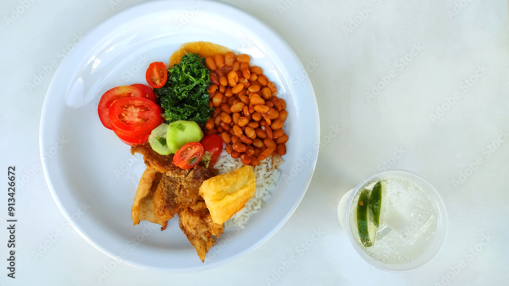Traditional brazilian meal known as prato feito and a cup with ...