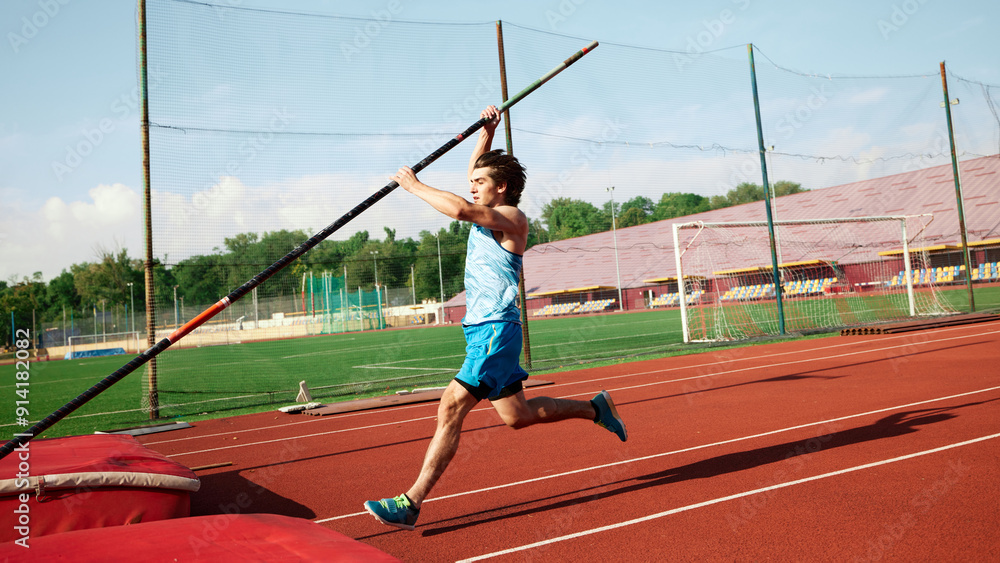Determined pole athlete training hard, focusing on strength and ...