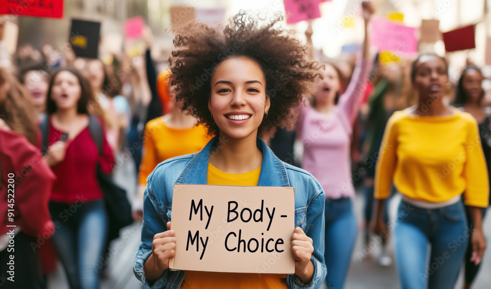 Confident Young Woman Leading Feminist Protest, Smiling and Holding 'My ...