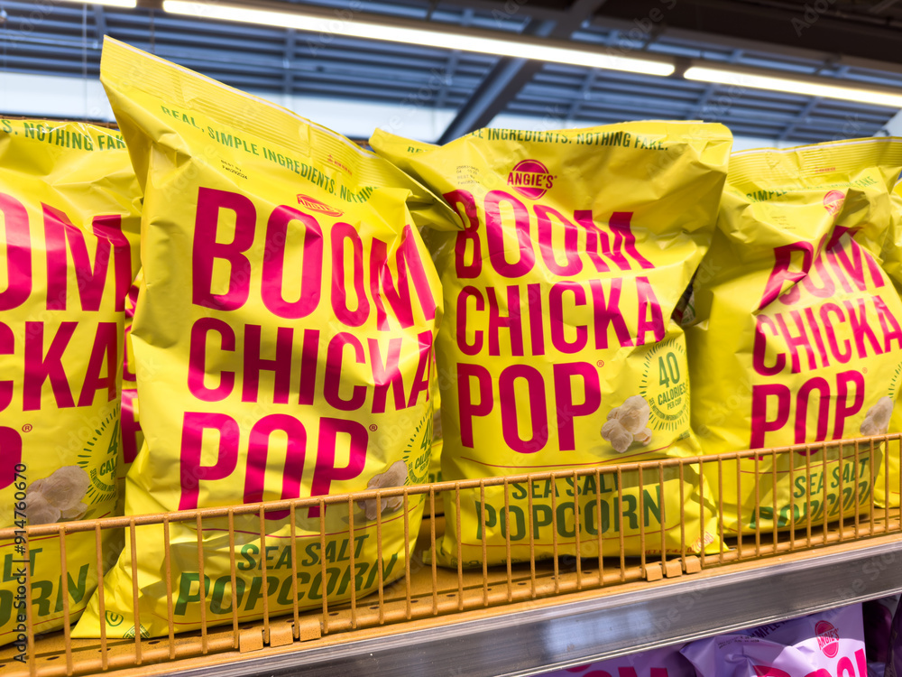Boom Chicka Pop bags of popcorn on the snack shelf inside a supermarket ...