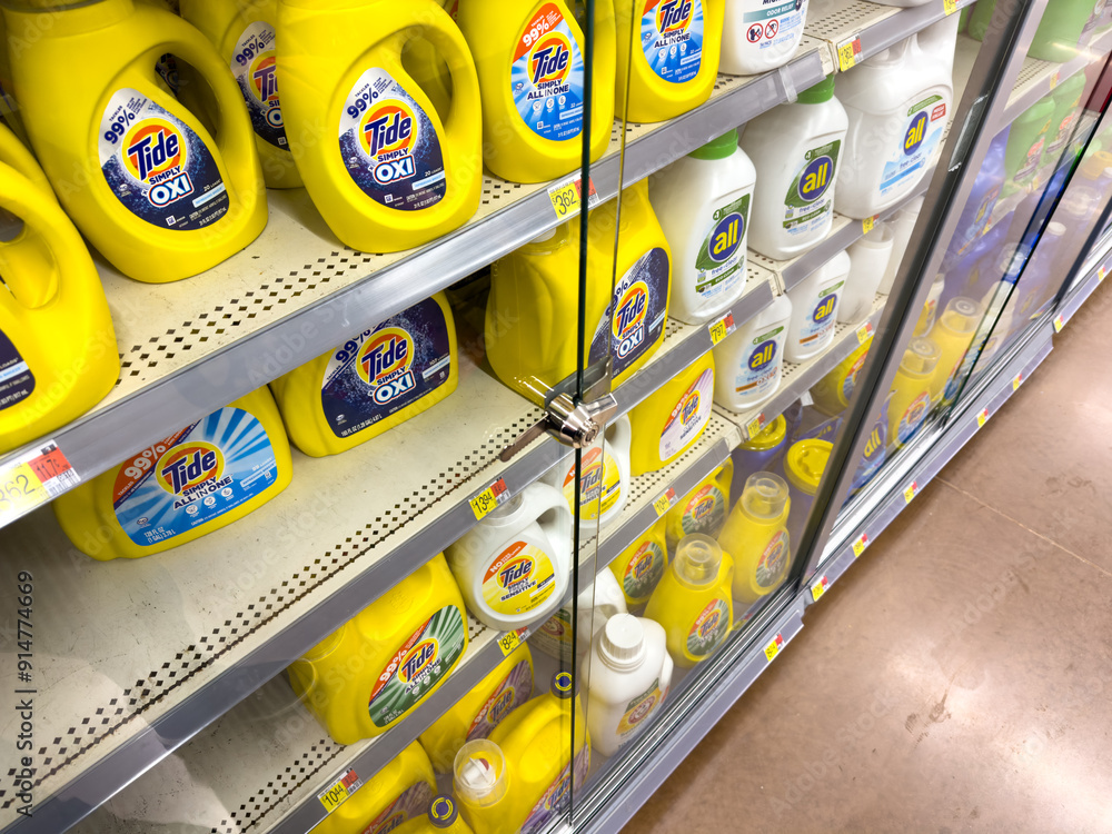 Locked laundry detergent behind glass doors inside a Walmart ...