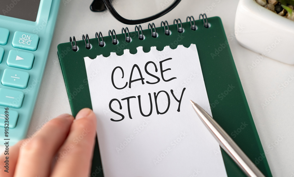 Card with case study text on a white background with office items ...