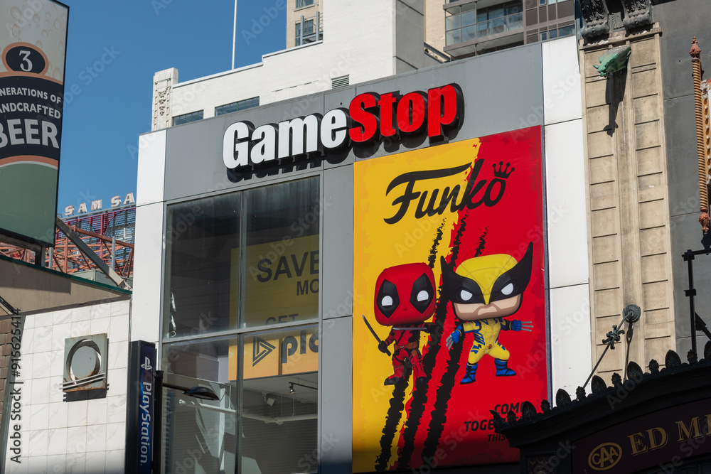 exterior building facade and signage of GameStop, a video game store ...