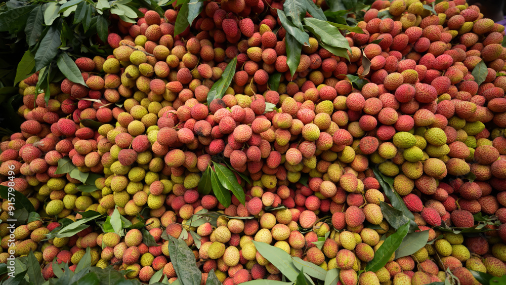 Freshly picked ripe lychees, ready for sale at the market. Vibrant ...