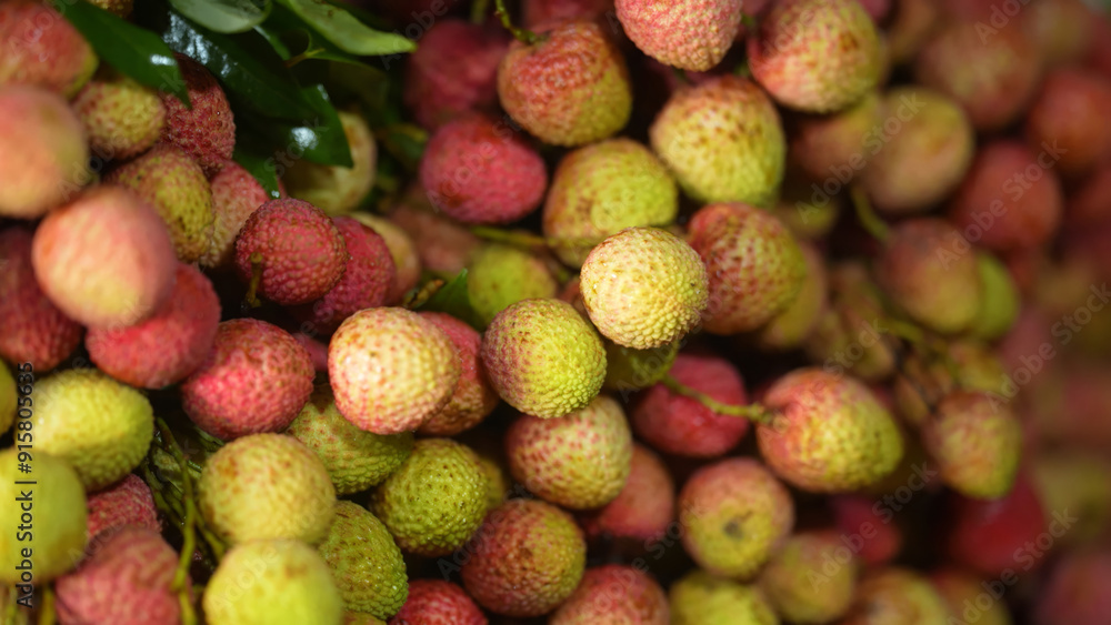 Freshly picked ripe lychees, ready for sale at the market. Vibrant ...
