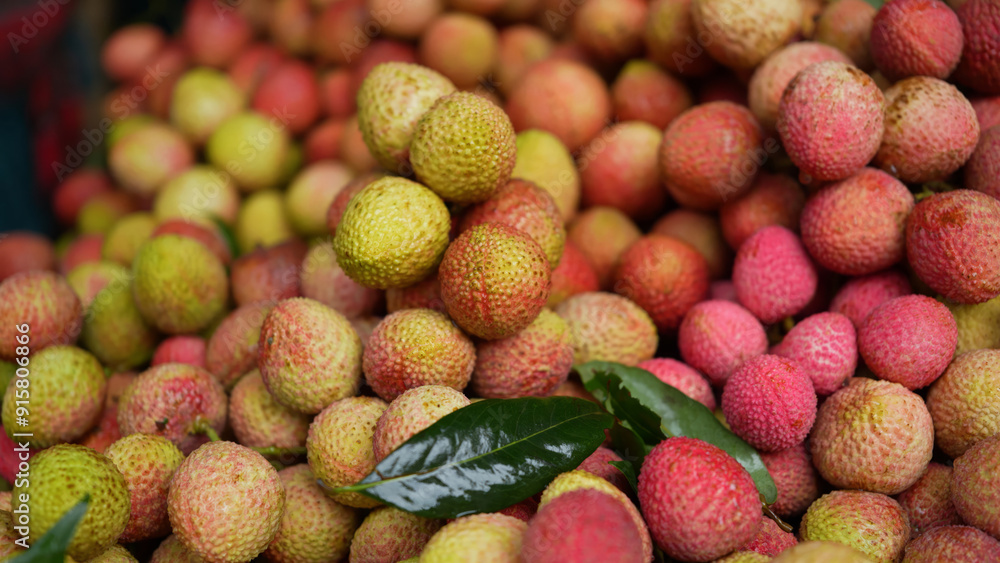 Freshly picked ripe lychees, ready for sale at the market. Vibrant ...