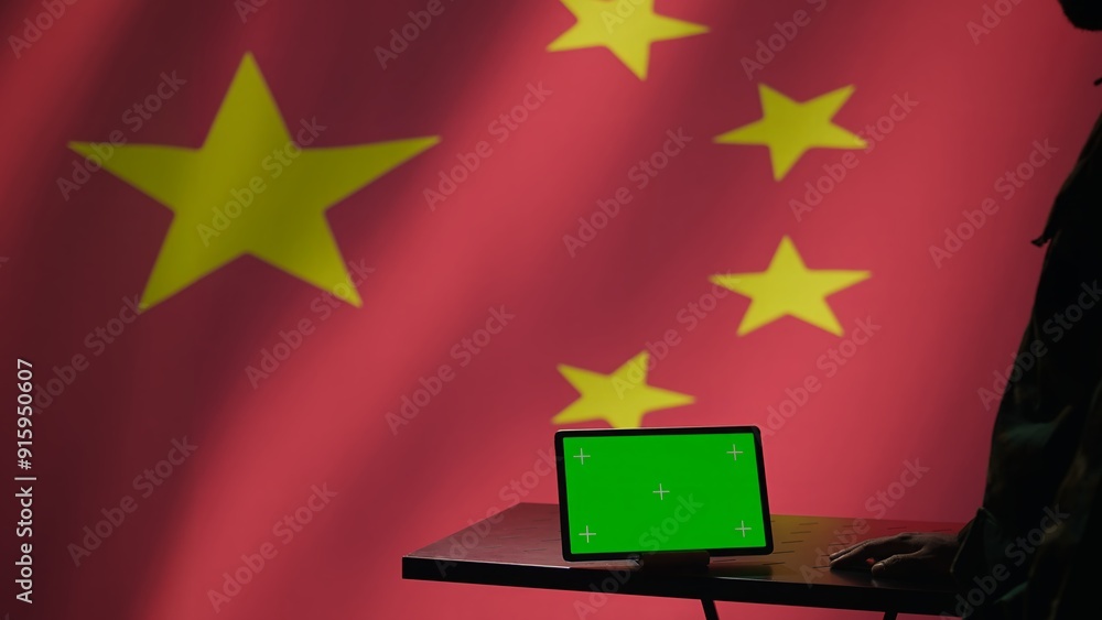 Chinese intelligence agency operator using green screen tablet to do ...