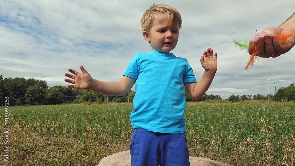 Vertical video of upset unhappy child in field. Concepts of sadness ...