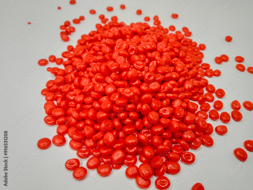 red polymer masterbatch granules isolated on white background for ...