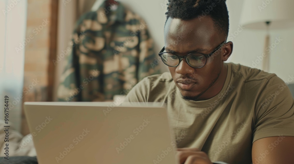 Plans, remote work, laptop, serious soldier, and black man typing at ...