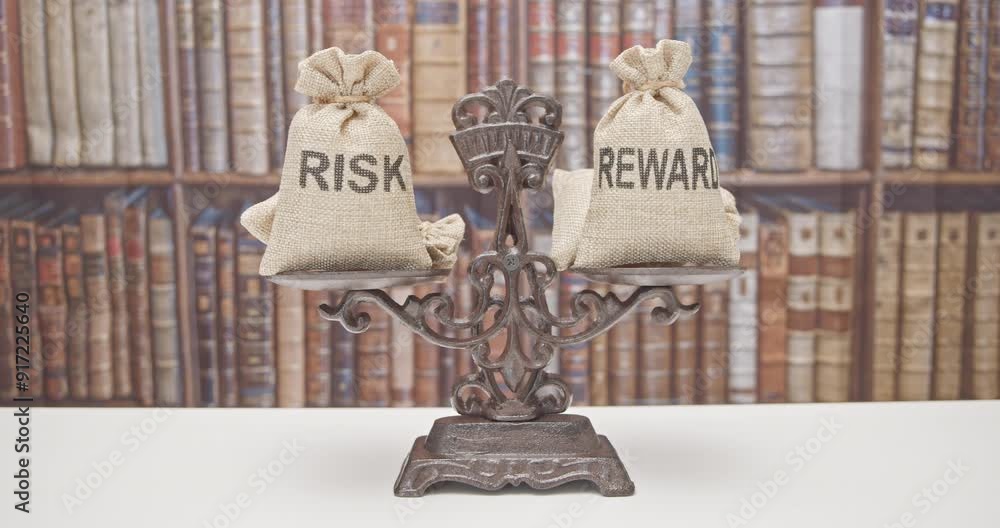 Risk reward ratio / risk management concept : Risk and reward bags on a ...