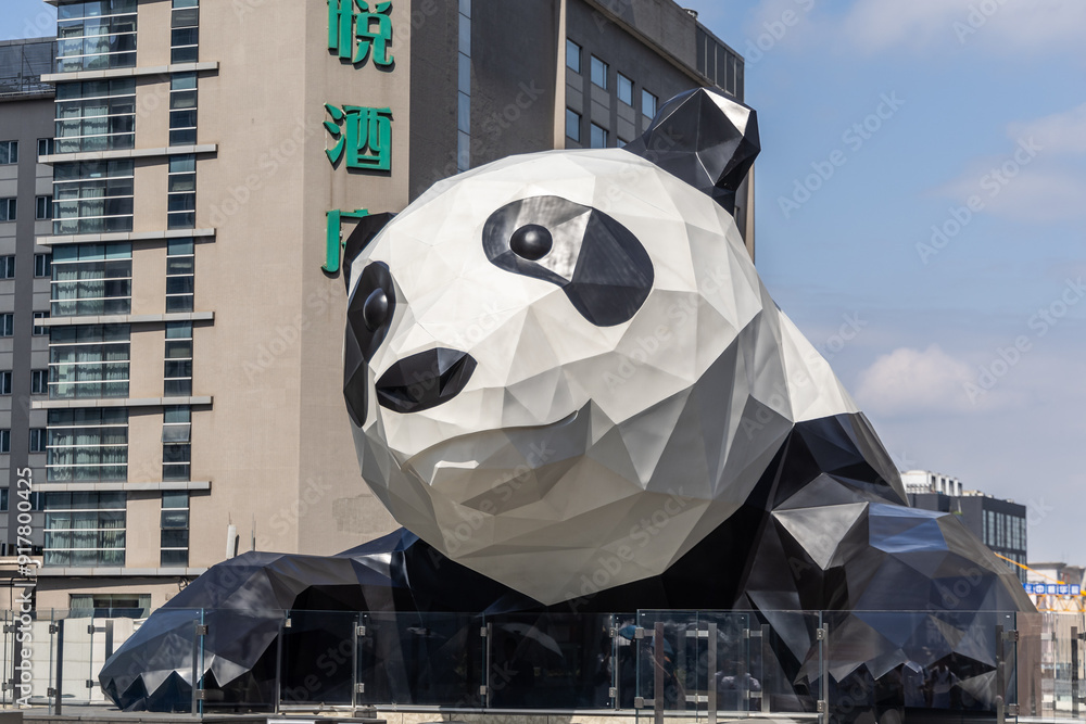 Close-up front view and face of Giant Panda clinging onto the IFS Mall ...