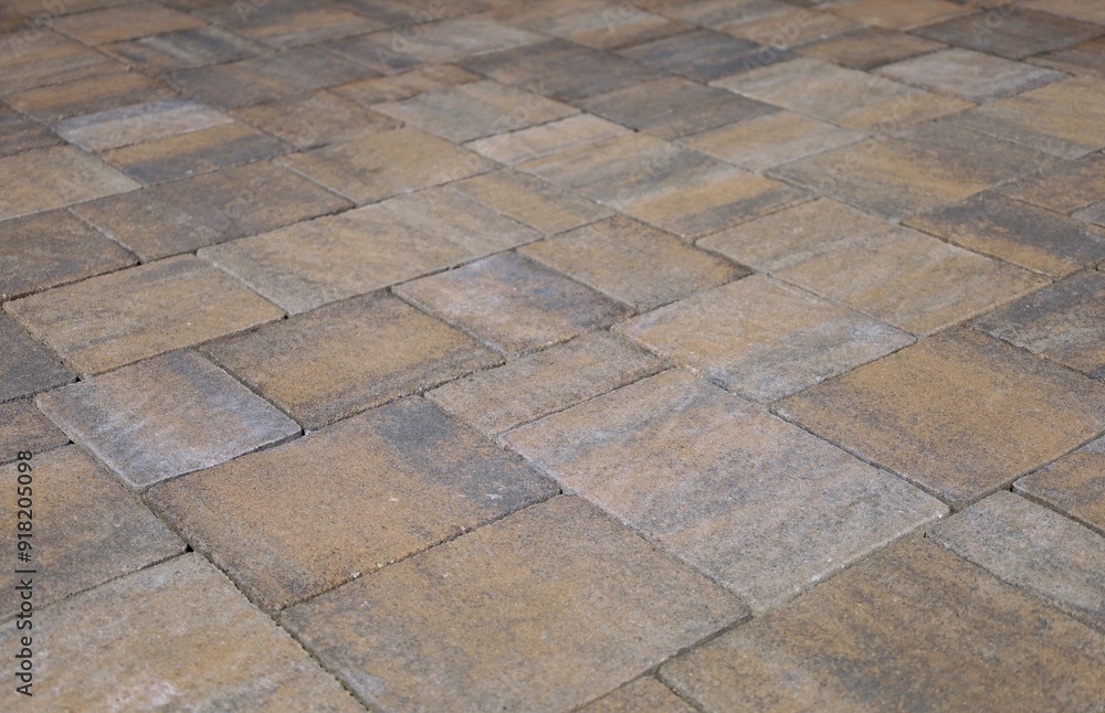 Brown and gray concrete paver blocks of different shapes. Stone effect ...