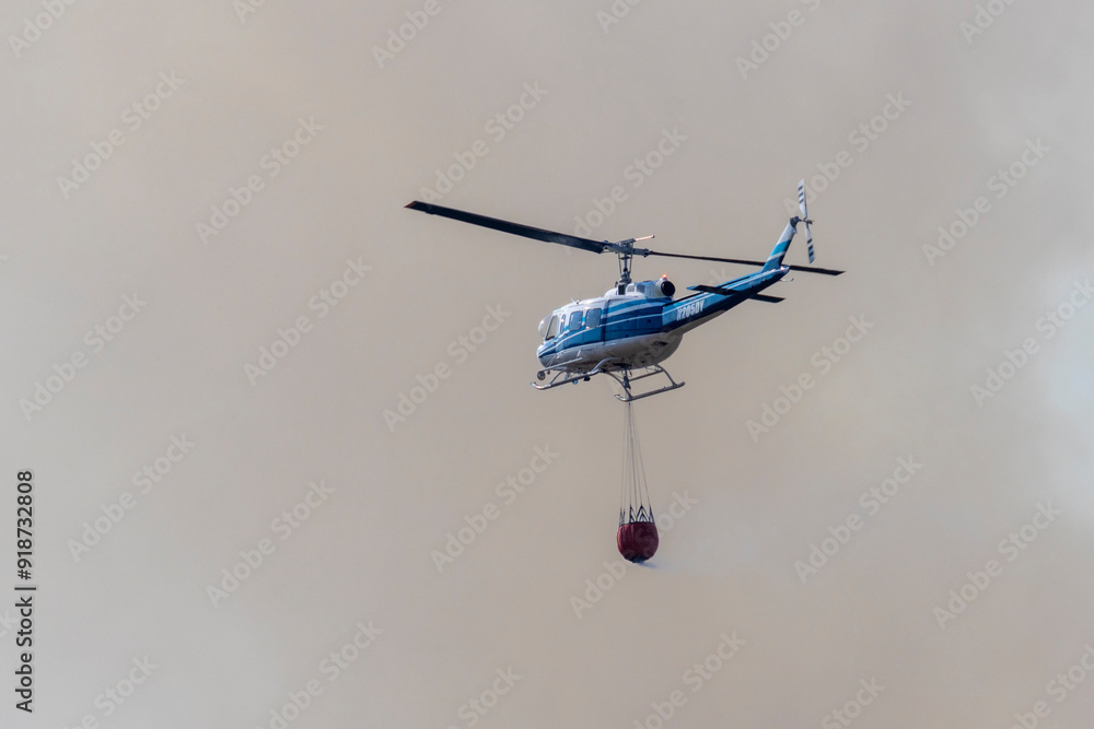 REDDING CALIFORNIA – AUGUST 10, 2024 –A Bell UH-1 helicopter with a ...