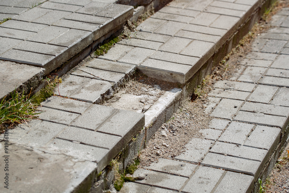 Damaged stair steps made from paving slab unsafe for pedestrians ...
