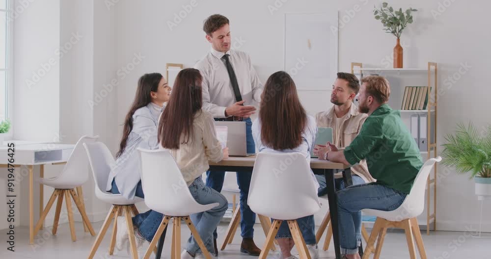 Team of business people working together in the office, conducting a ...