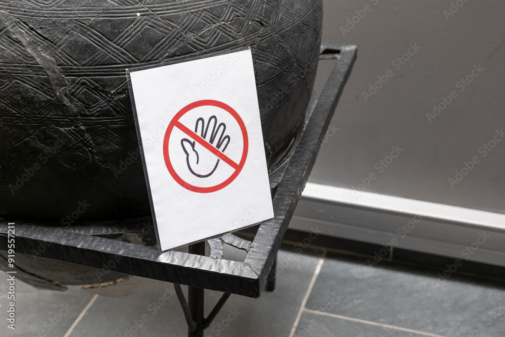 A simple do not touch label warning sign with a crossed out hand symbol ...