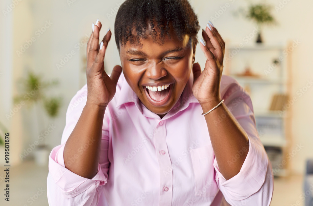 Portrait of a depressed african american woman shouting and screaming ...