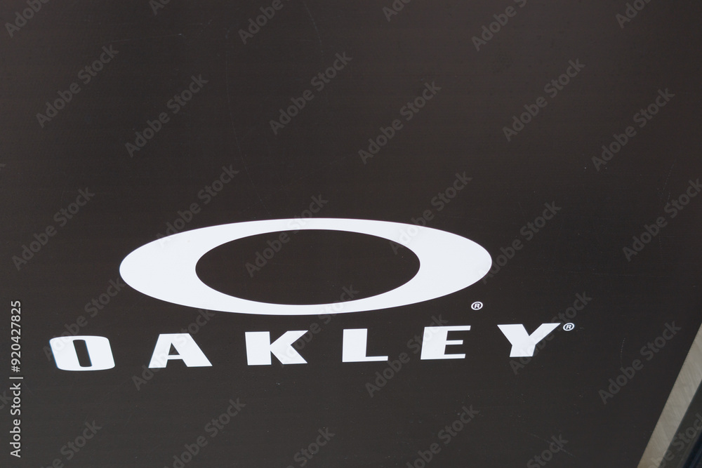 oakley shop brand logo and sign text in windows optical store chain ...