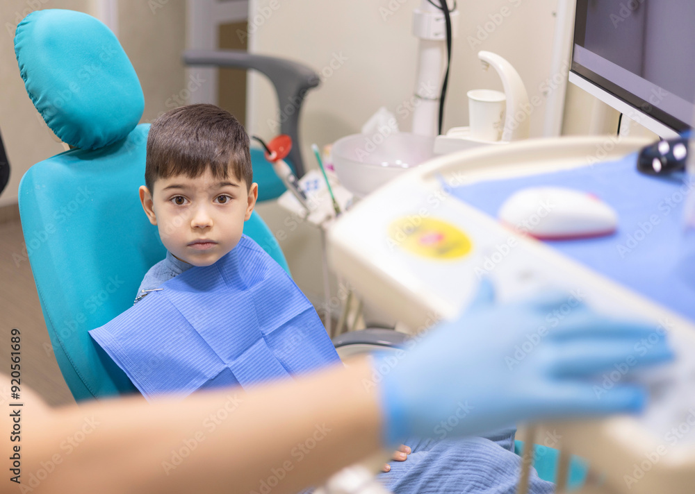 kid in dental office. dentist checking child teeth using tools mouth ...