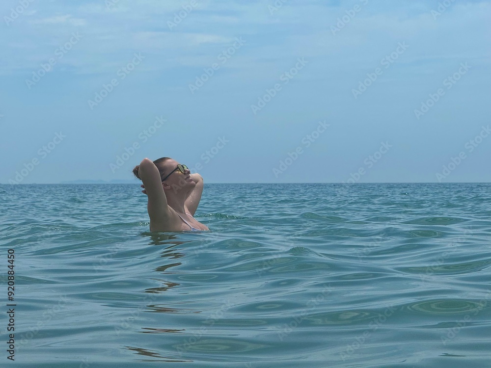 portrait of a beautiful young woman on vacation enjoying a holiday at ...