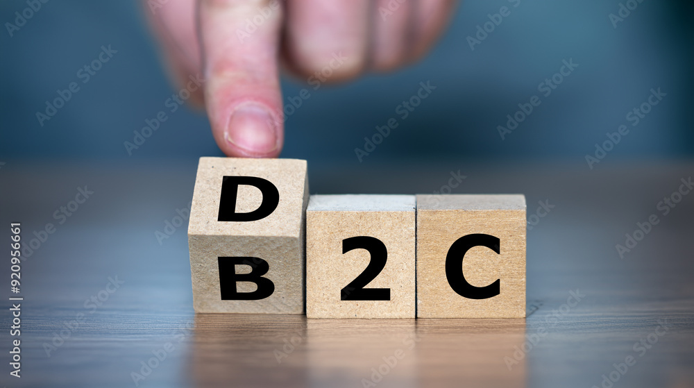 Hand turns wooden cube and changes the expression B2C (Business-to ...