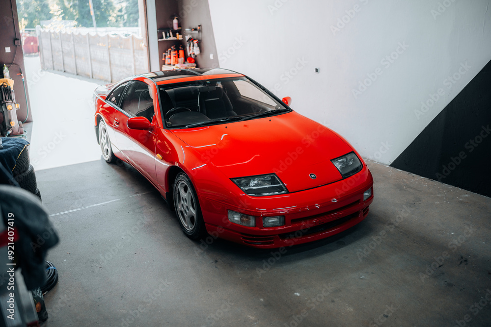 Photo of a red Nissan 300ZX Twin Turbo. They show details of the car ...