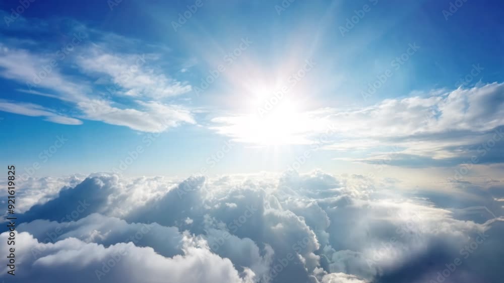 blue sky with clouds and sun. seamless and looping animation background ...