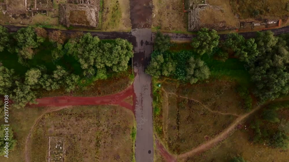 Top-down aerial view of Avenue of the Dead, Teotihuacan. Ascending tilt ...