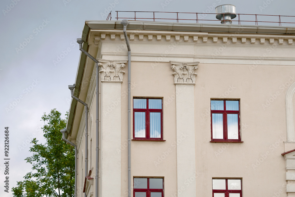 Building with pilaster capital on historic facade, classical ...