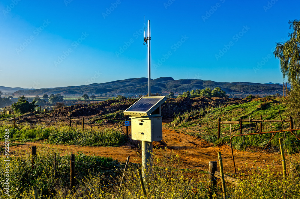 Remote weather station with solar panel and radio link on the outskirts ...